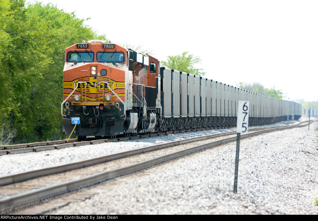 BNSF 7655 DPU on a unit train headed to Vulcan Materials Frisco, TX